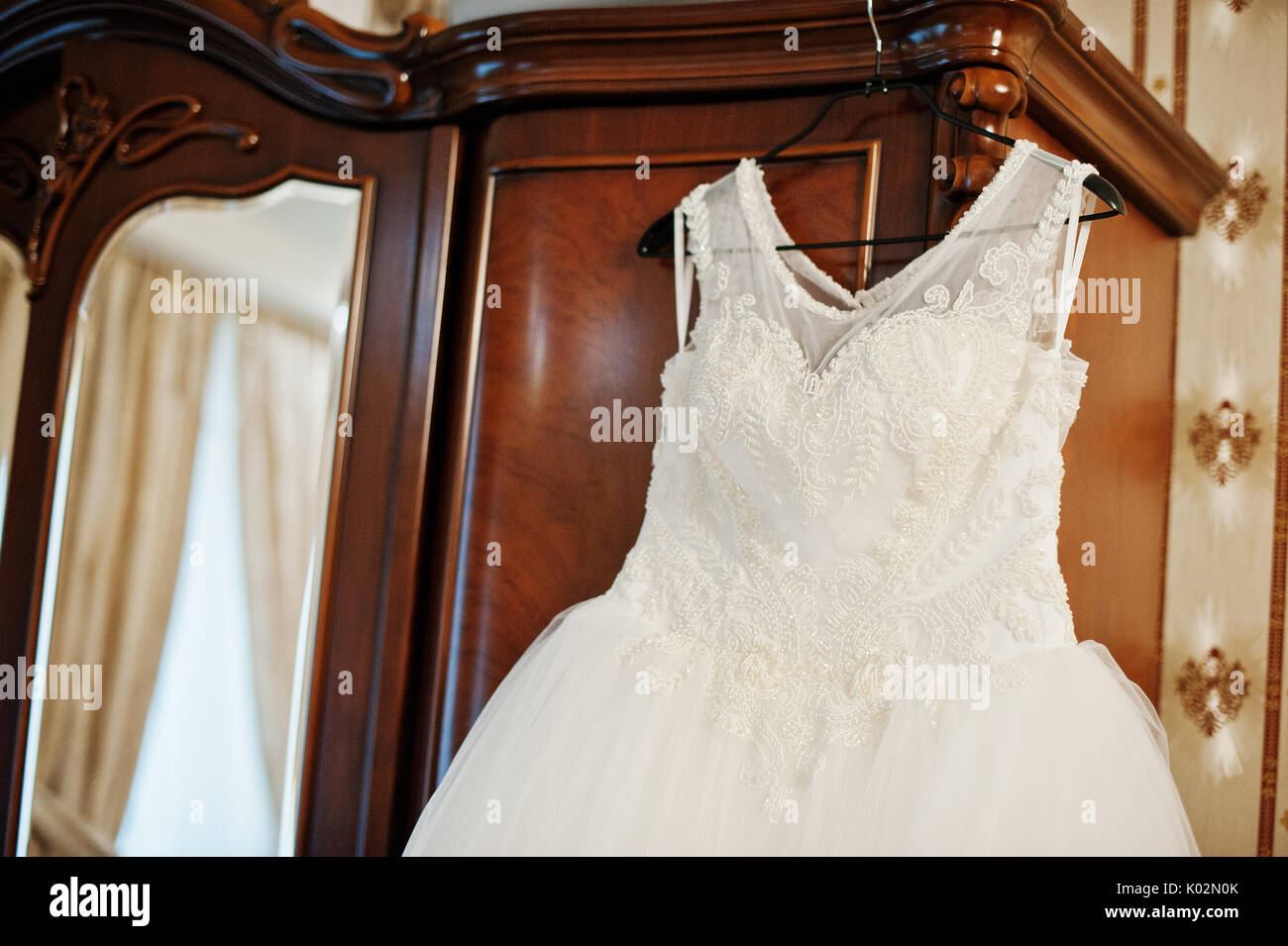 Wedding dress hanging on the rack on the wardrobe in the room Stock ...