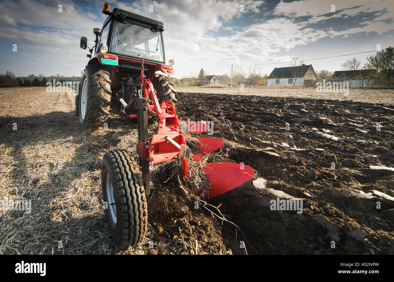 Tractor preparing land for sowings Stock Photo - Alamy