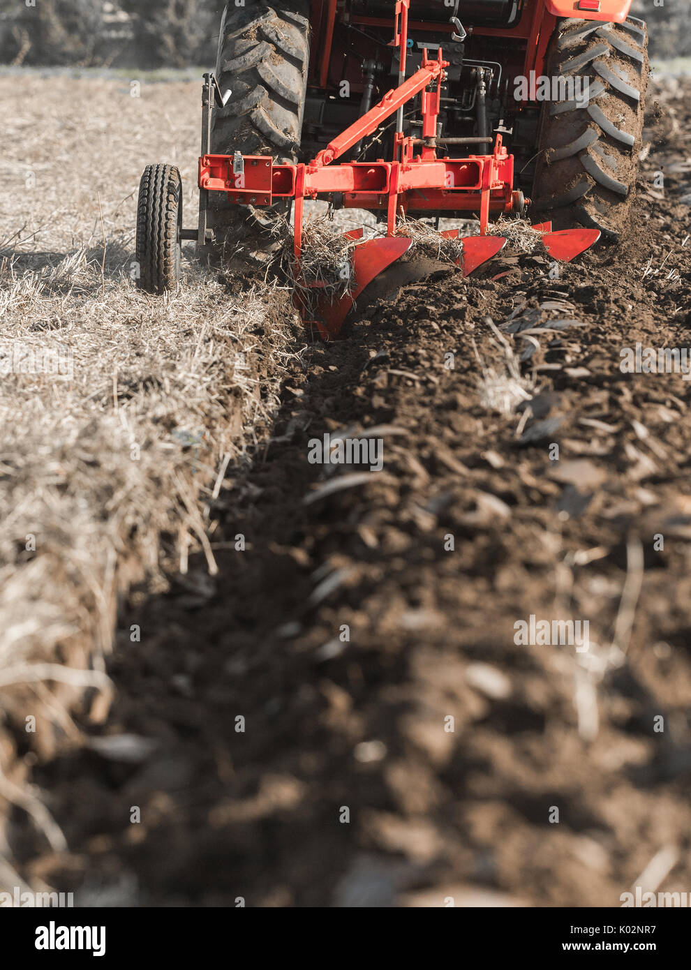Tractor preparing land for sowings Stock Photo - Alamy