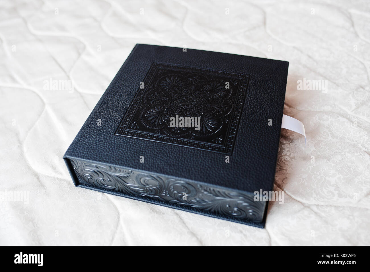 Gorgeous black leather box with wedding photobook or photo album in it ...