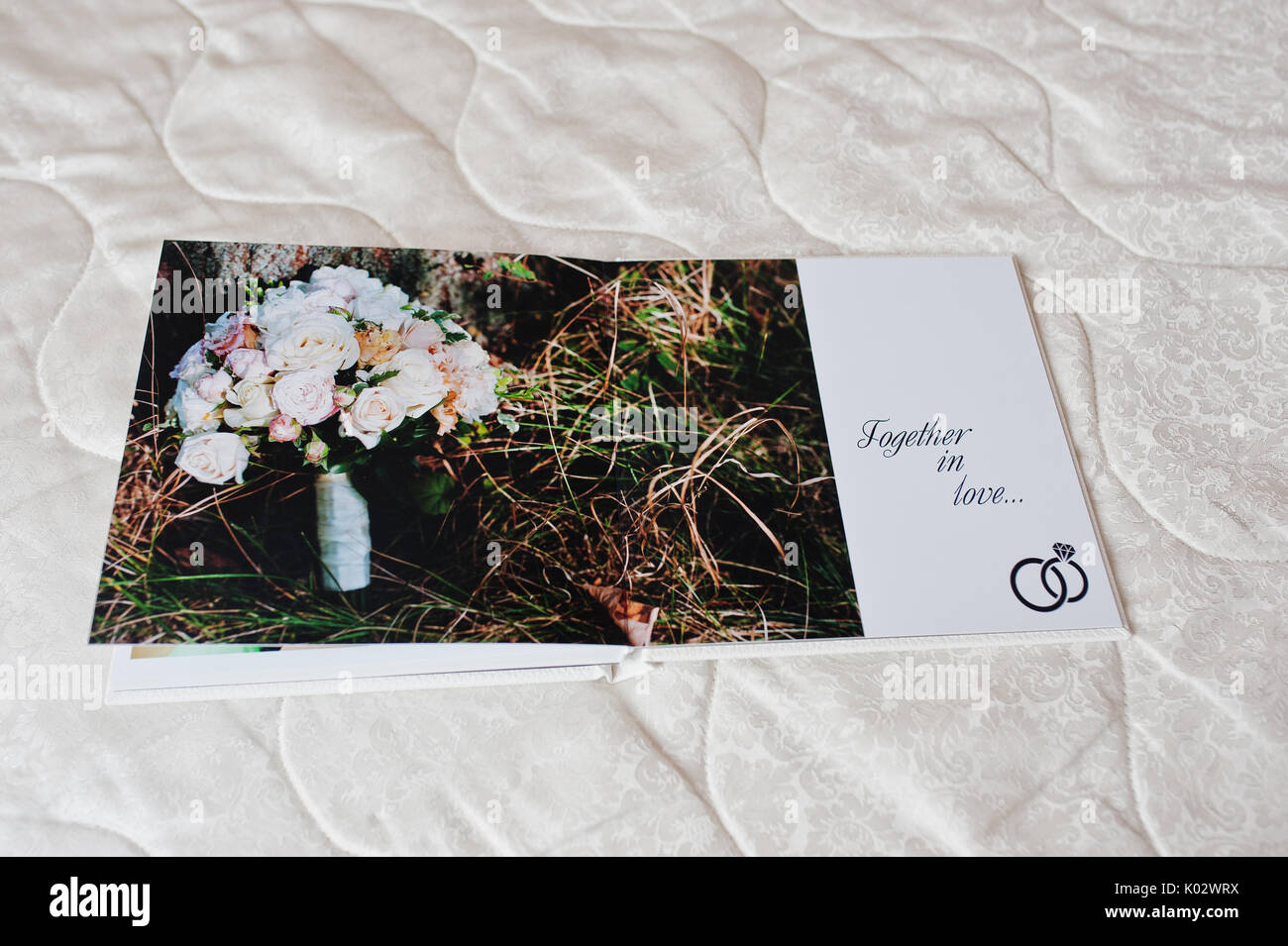 Pages of wedding photobook or wedding album on white sofa background ...