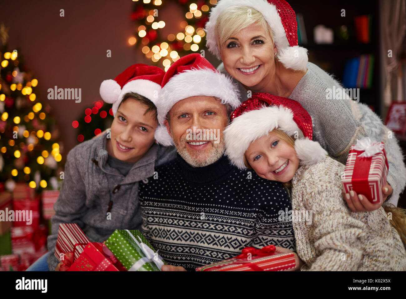 Positive cheerful family sitting hi-res stock photography and images ...