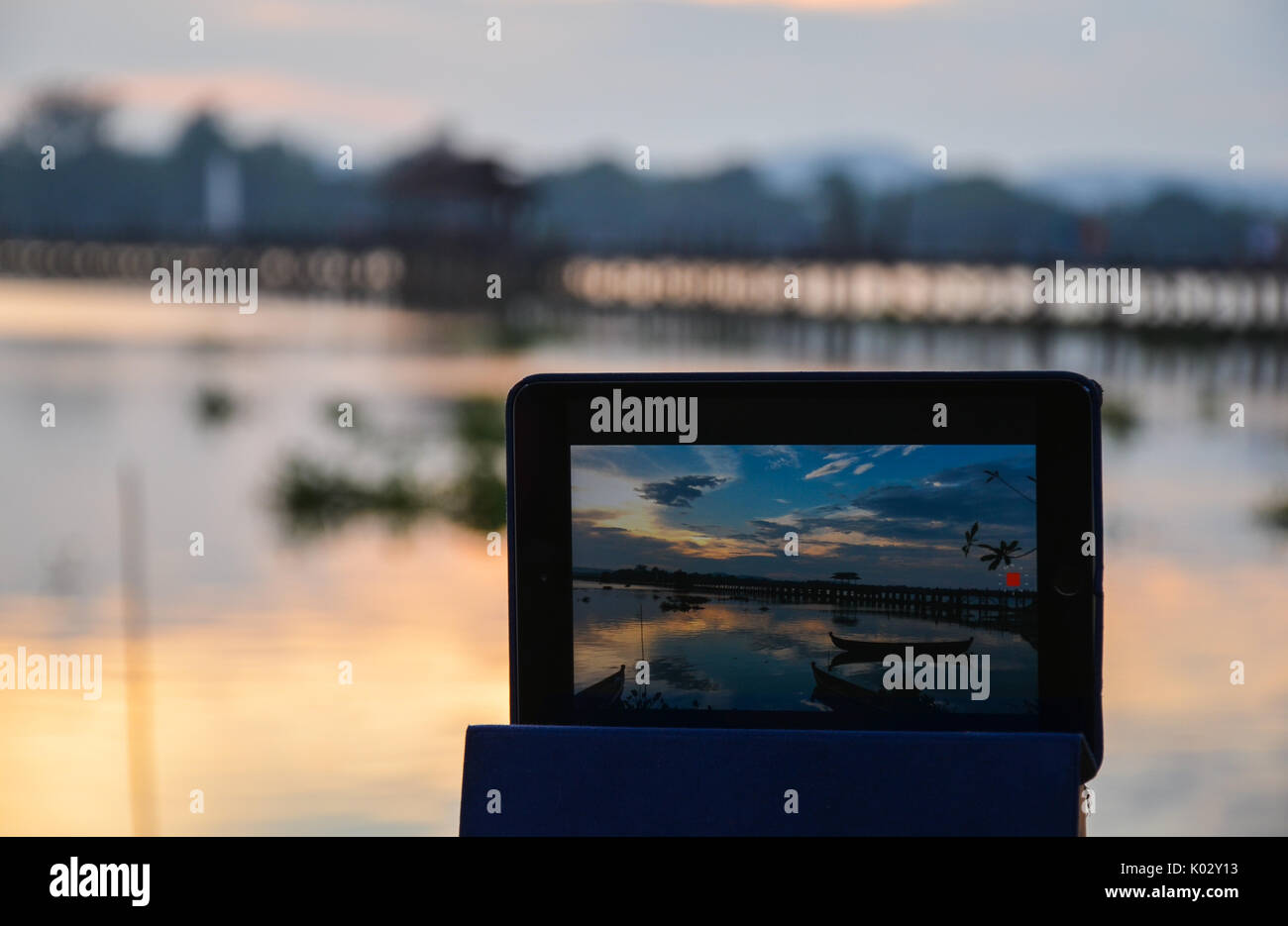 iPad shooting a time-lapse video at U Bein Bridge in Mandalay, Myanmar ...