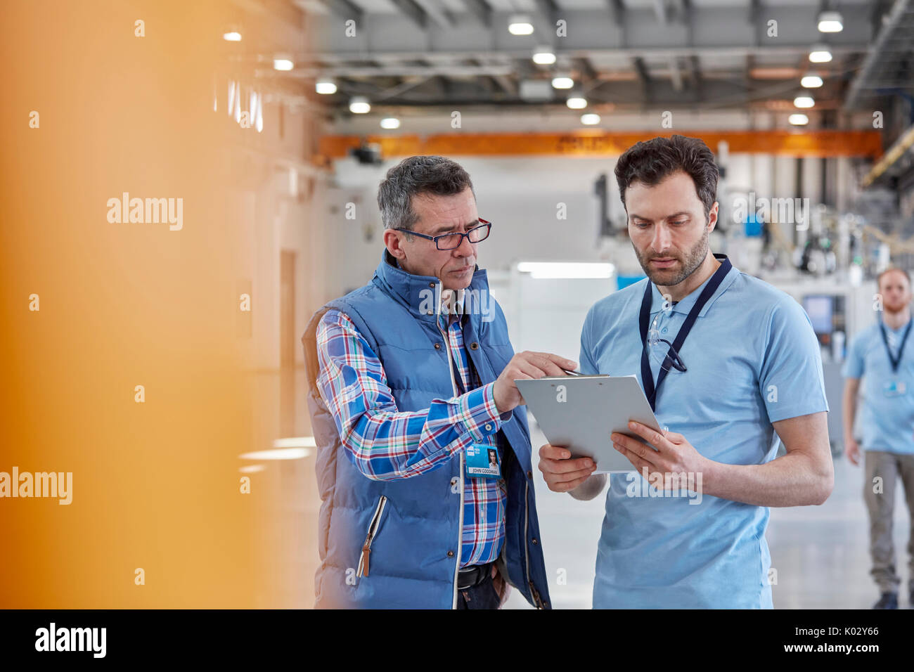 Mature worker talking hi-res stock photography and images - Alamy