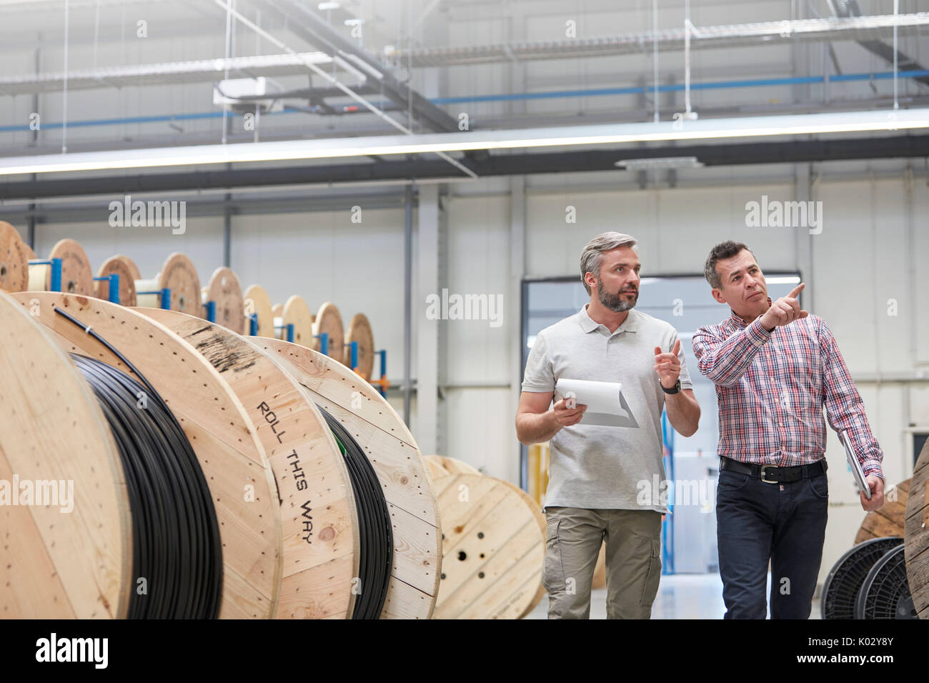 Business man walking into factory hi-res stock photography and images ...