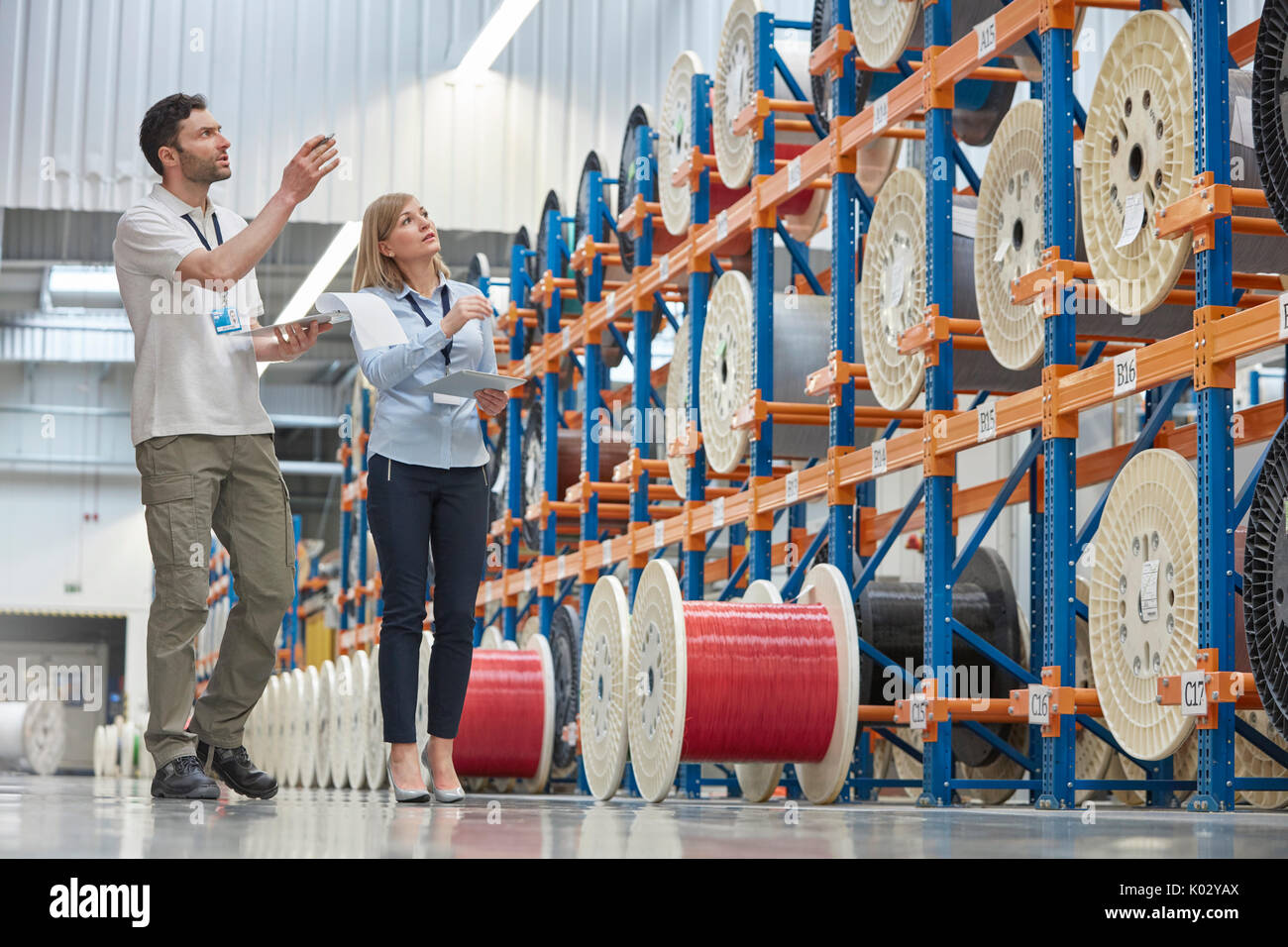 Female warehouse supervisor holding hi-res stock photography and images ...