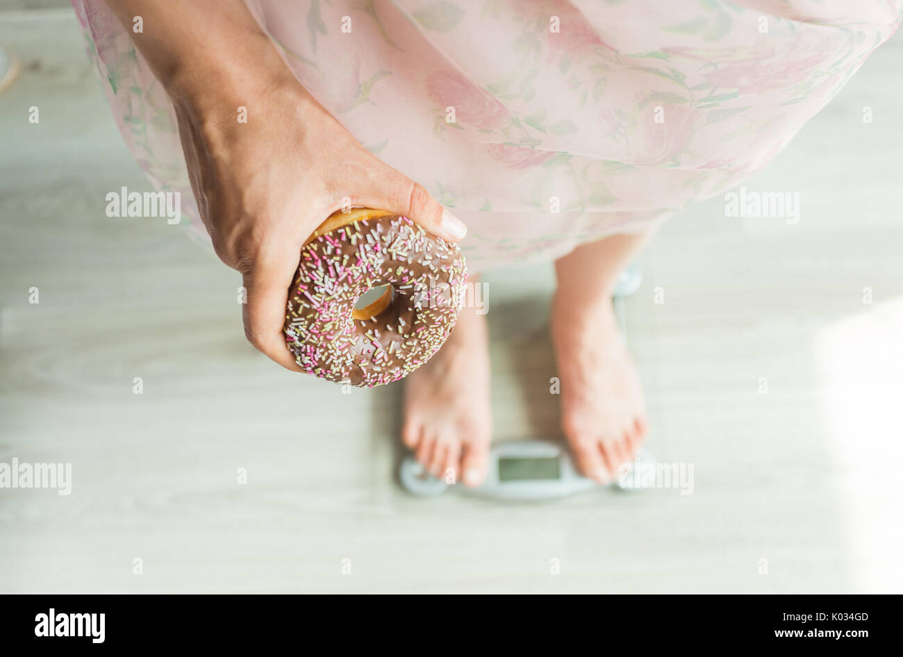 Diet Concept. Close-up of Woman's feet On Weighing Scale With Donut ...