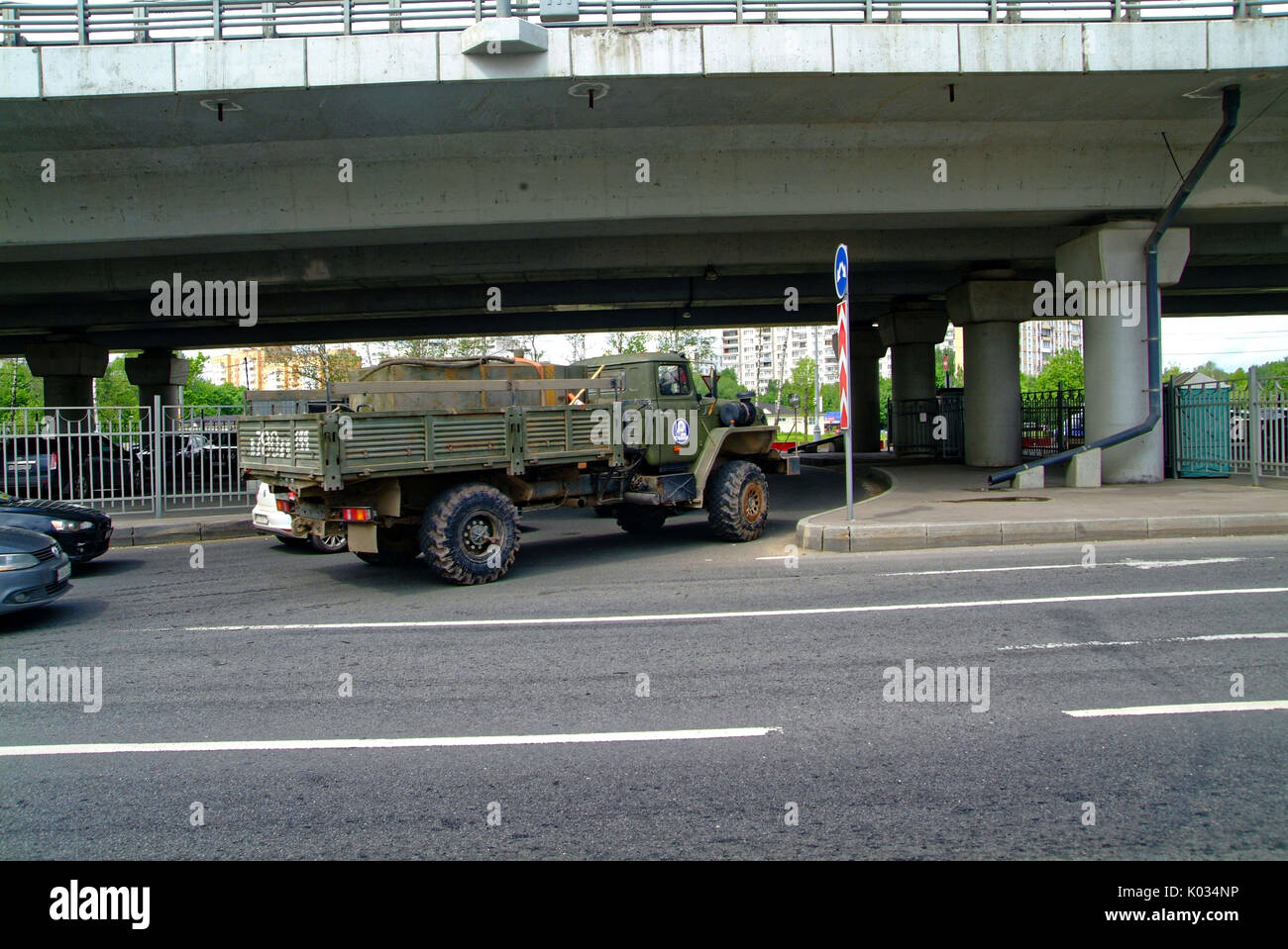 the cars are going to turn under a highway bridge, district Teply Stan ...