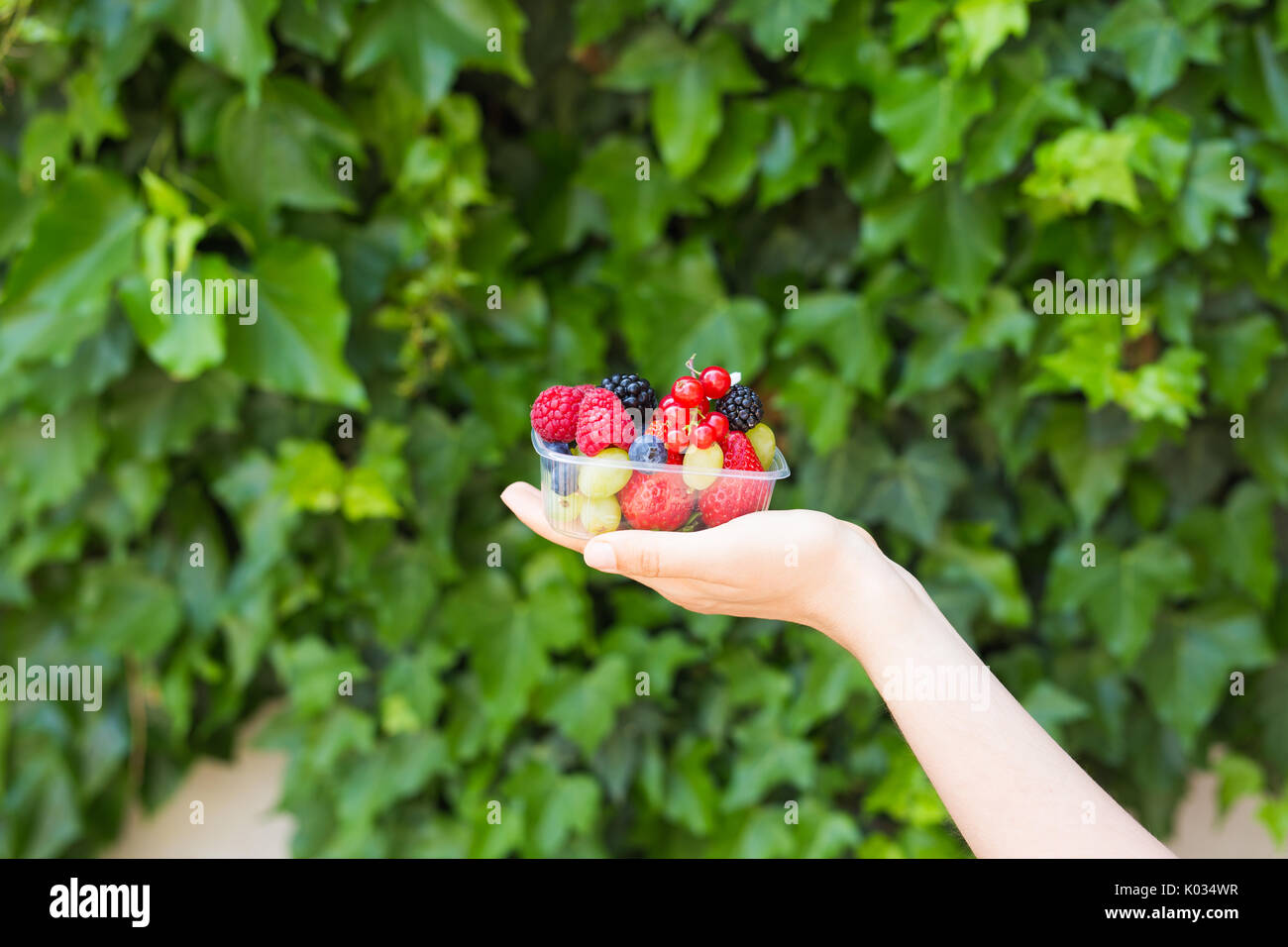 healthy eating, dieting, vegetarian food and people concept - close up ...