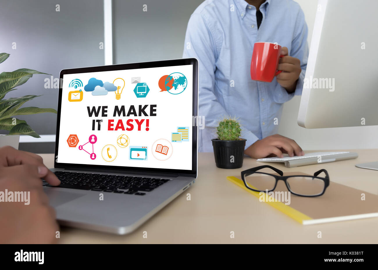 WE MAKE IT EASY! Business team hands at work with financial reports and ...