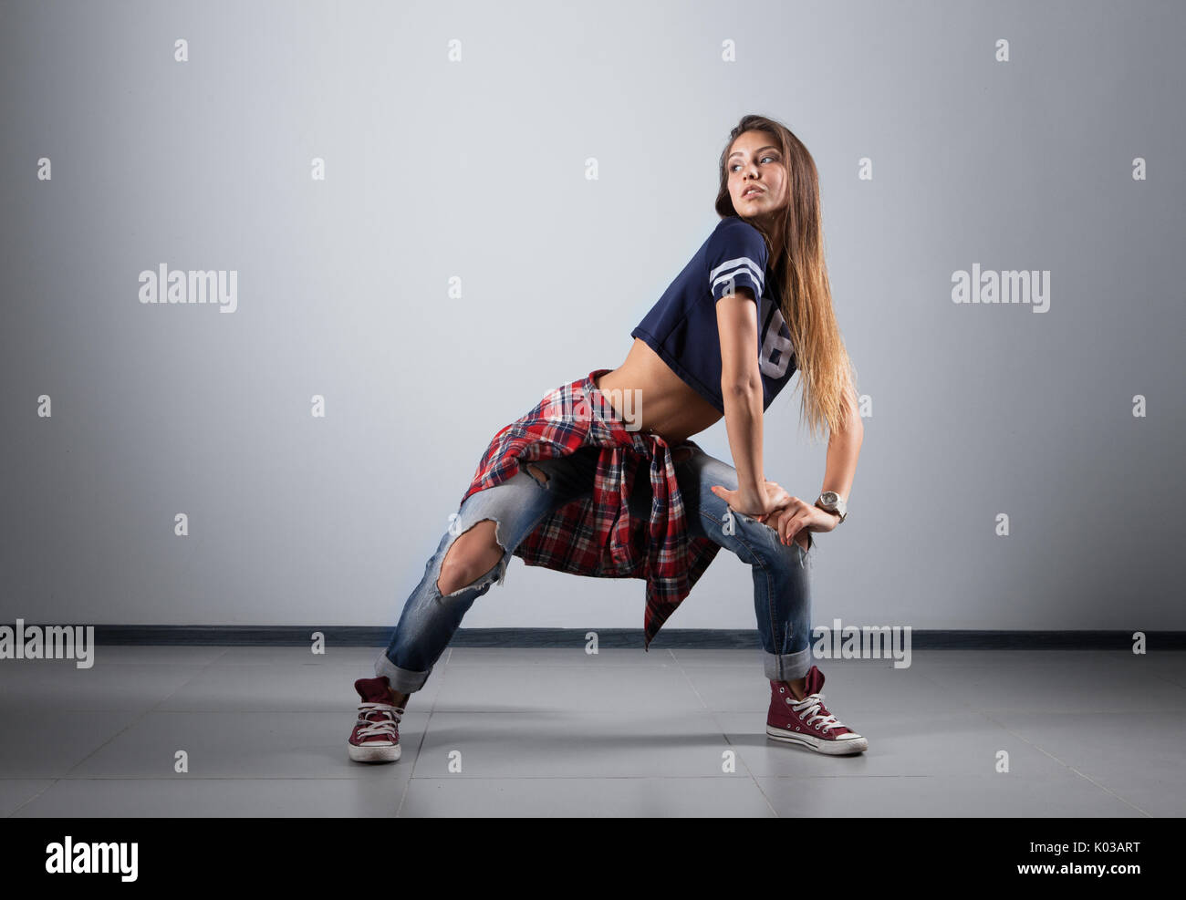 modern young beautiful dancer posing on a studio background Stock Photo ...