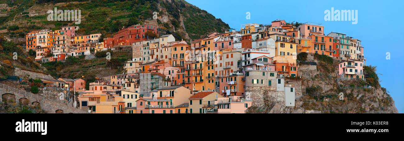 Italian style resident buildings over cliff panorama in Manarola in ...