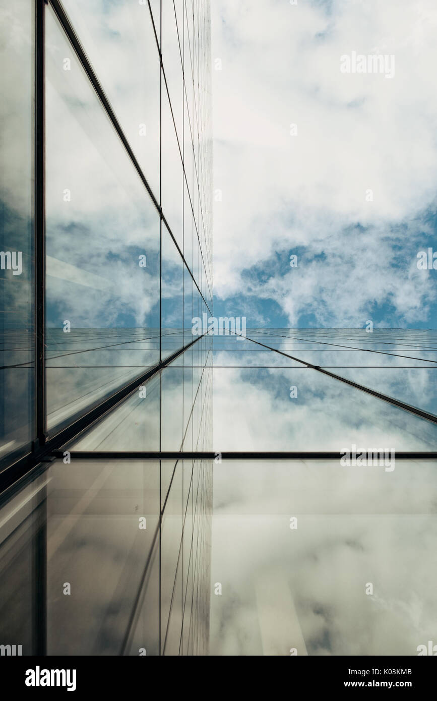 Glass reflection of skyscraper in Paris Stock Photo - Alamy