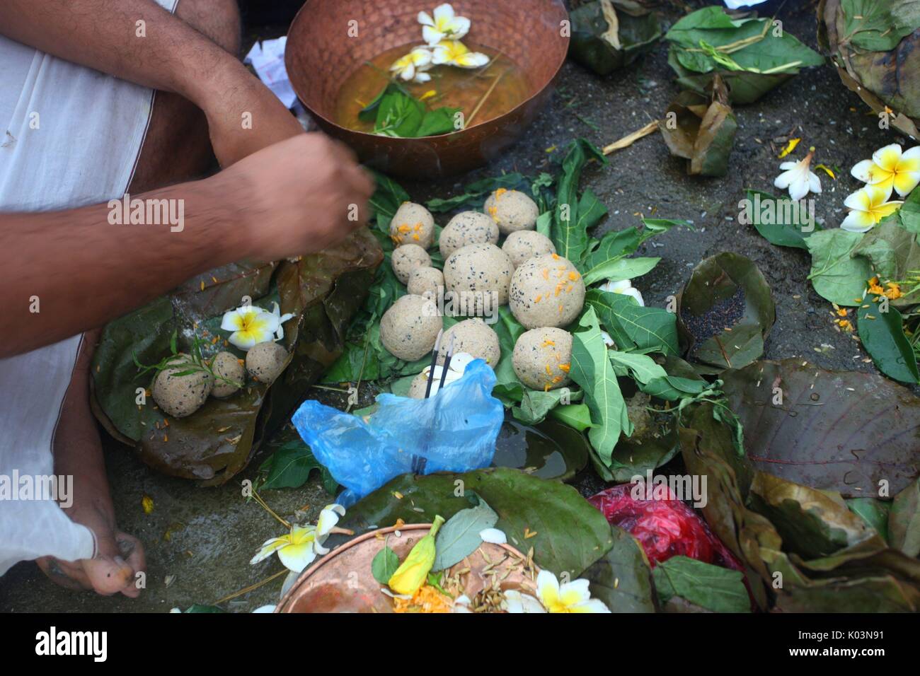 Kathmandu, Nepal. 21st Aug, 2017. A devotee performs religious rituals ...