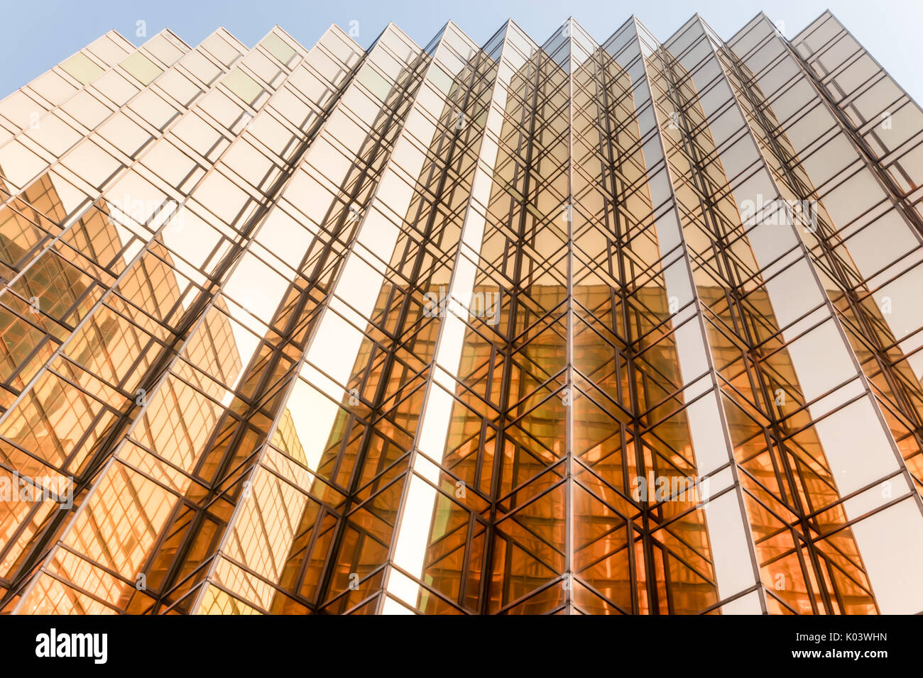 Gold colour office building tower facade in business center Stock Photo ...