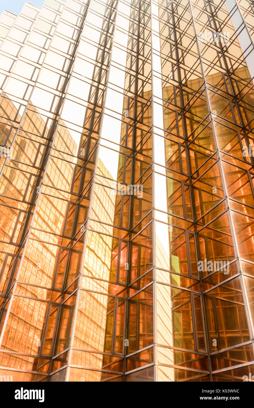 Gold colour office building tower facade in business center Stock Photo ...