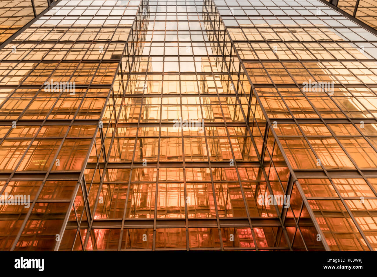 Gold colour office building tower facade in business center Stock Photo ...