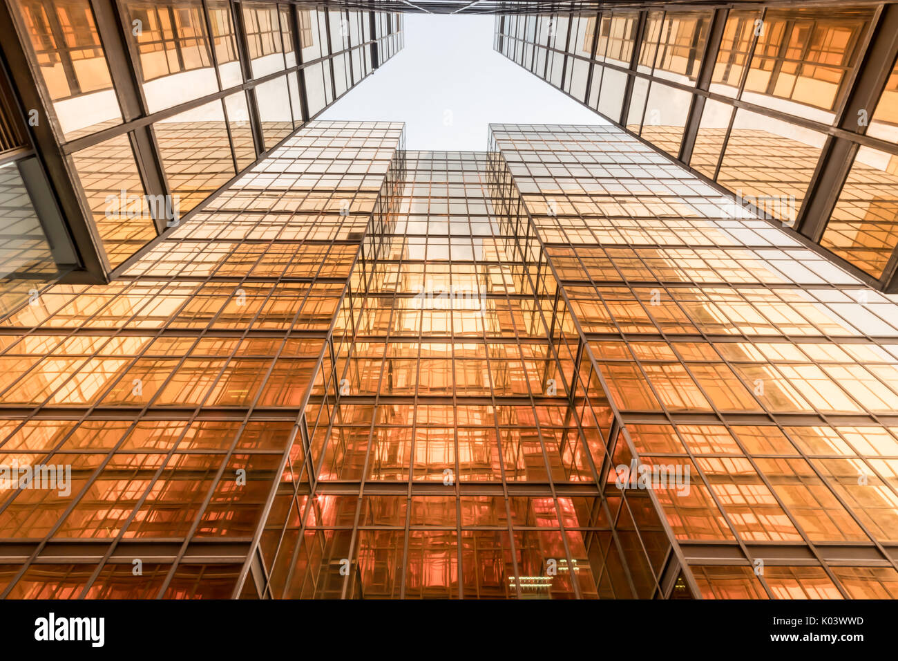 Gold colour office building tower facade in business center Stock Photo ...