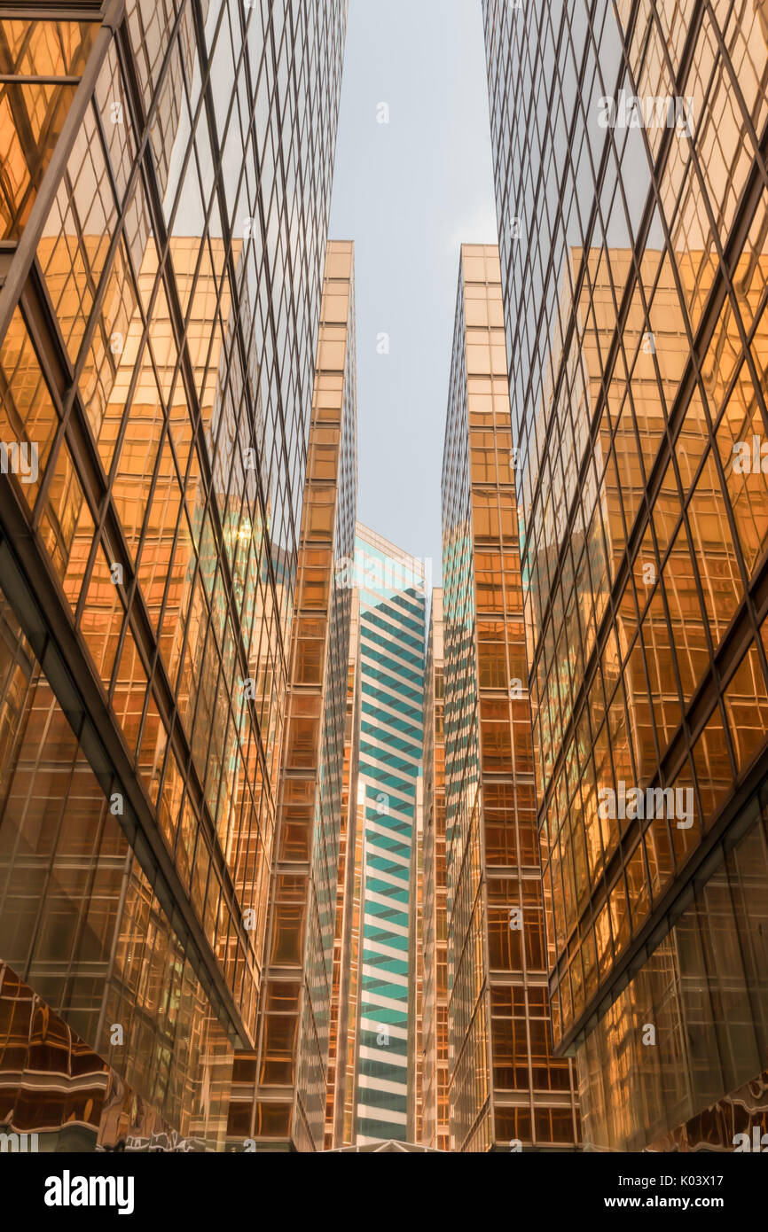 Gold colour office building tower facade in business center Stock Photo ...