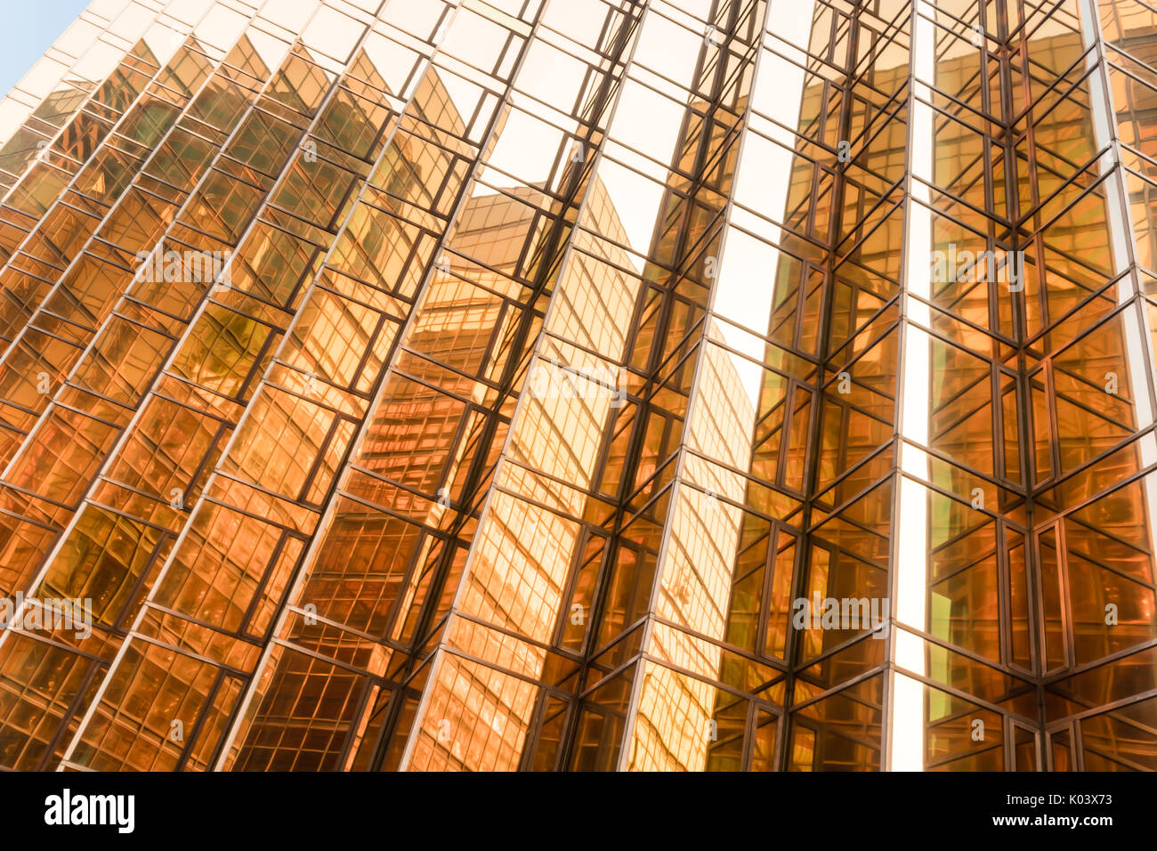 Gold colour office building tower facade in business center Stock Photo ...