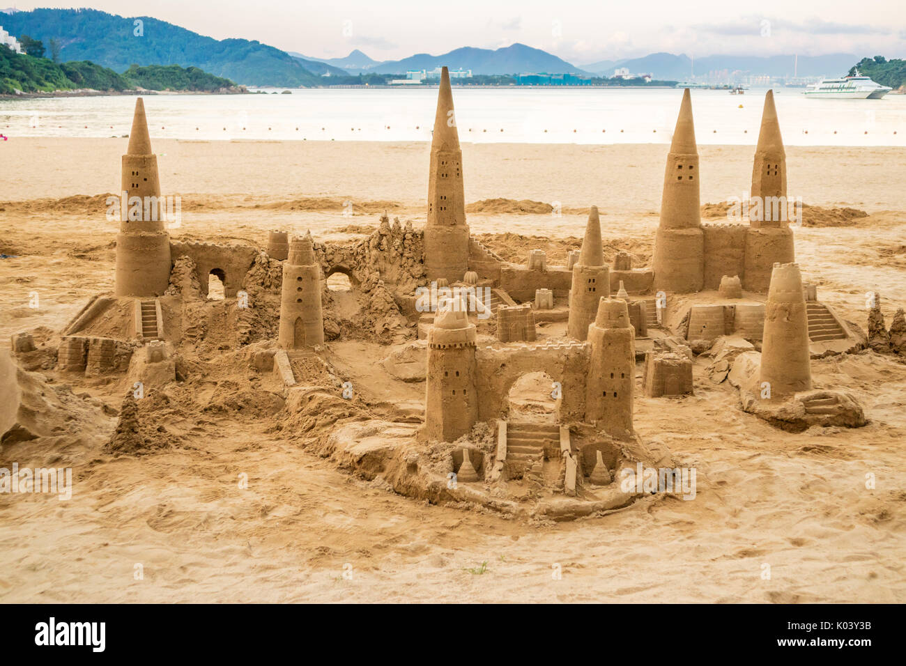 Fun Sand castle activity on the beach Stock Photo - Alamy