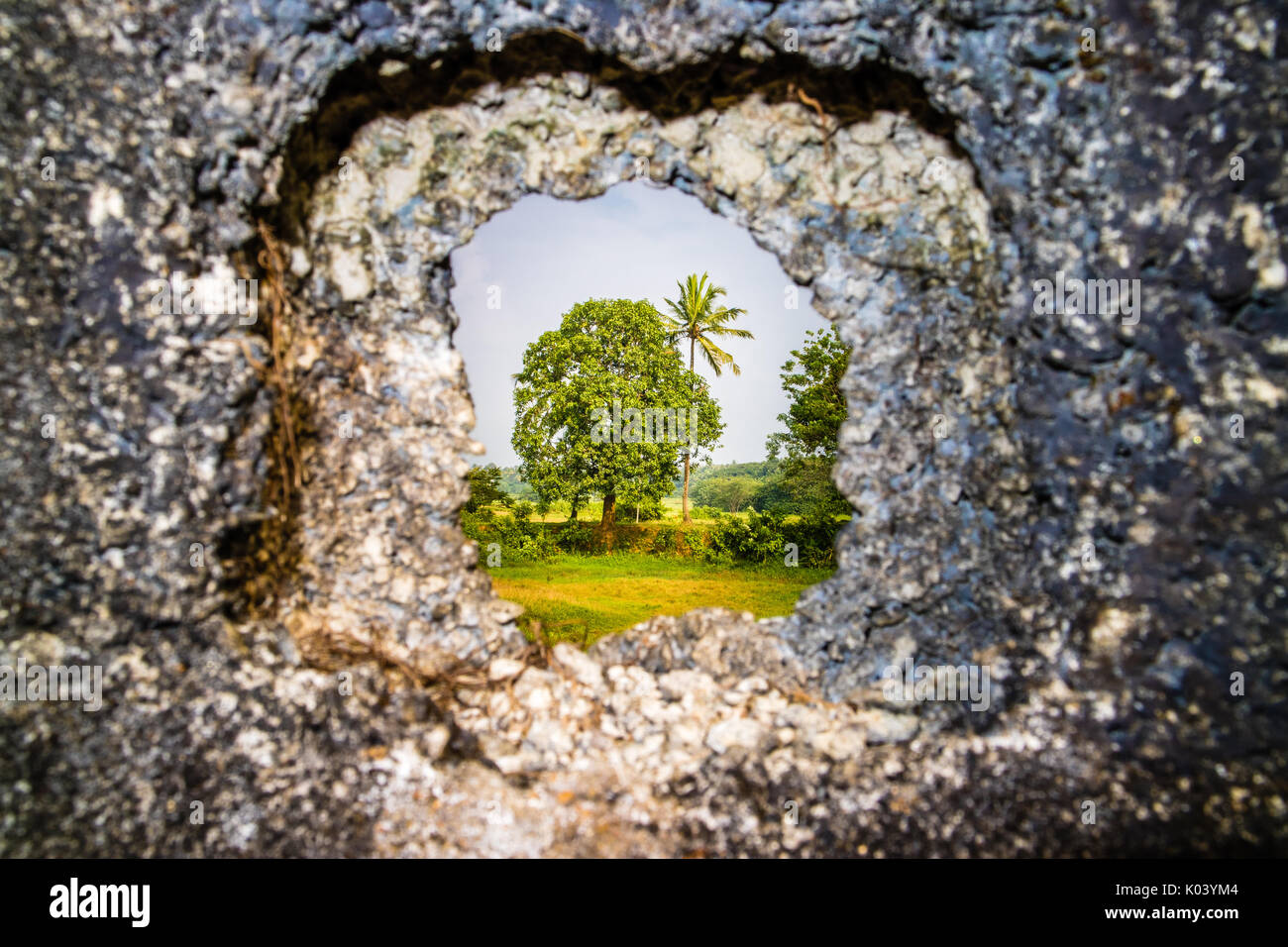 Keyhole view of nature from the wall Stock Photo - Alamy