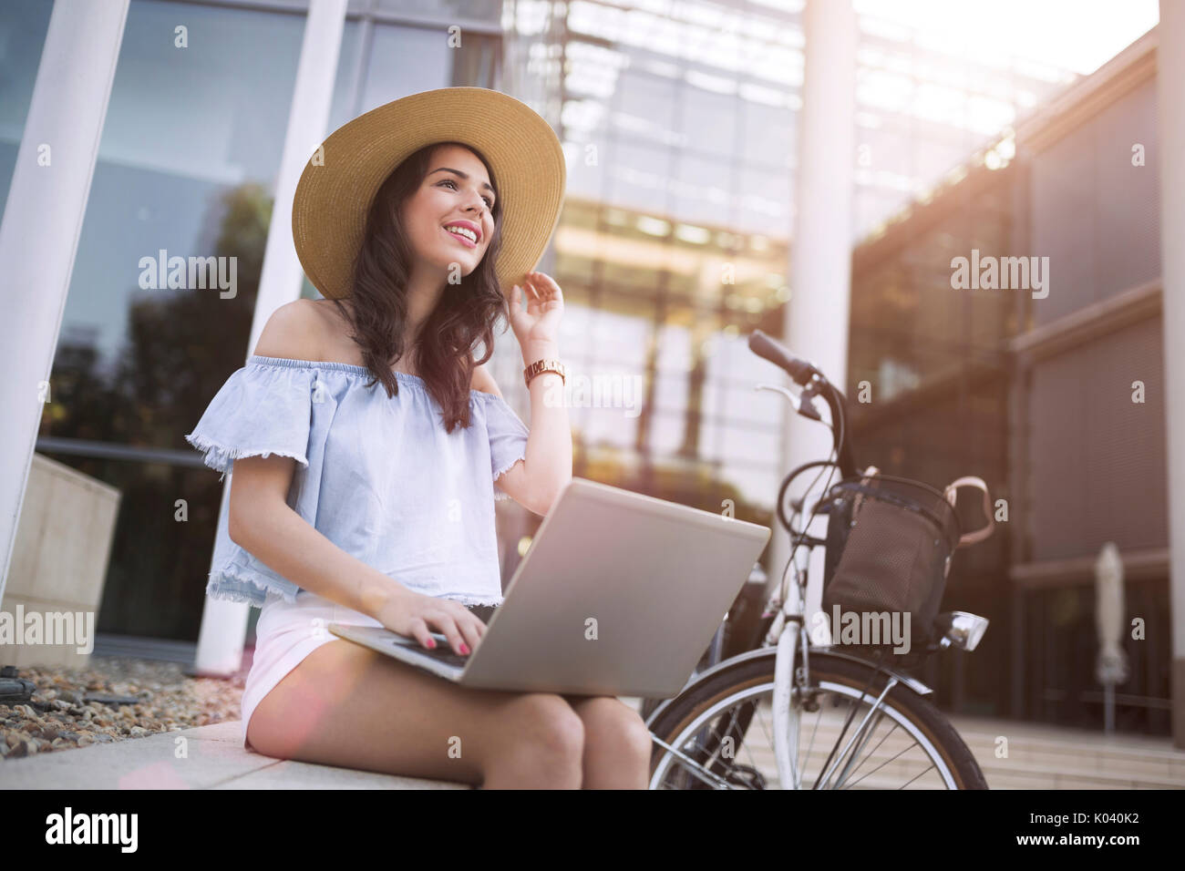 Portrait of attractive young girl using laptop Stock Photo - Alamy