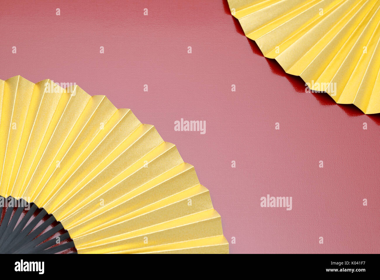 traditional japanese style golden hand fan on red background Stock ...