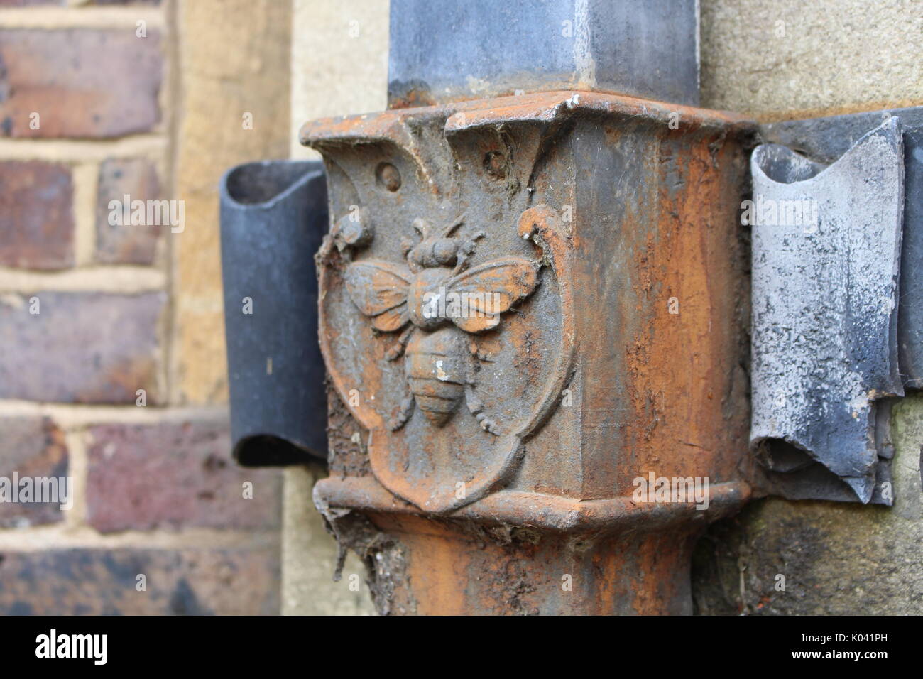 Cast iron bee on guttering Stock Photo - Alamy