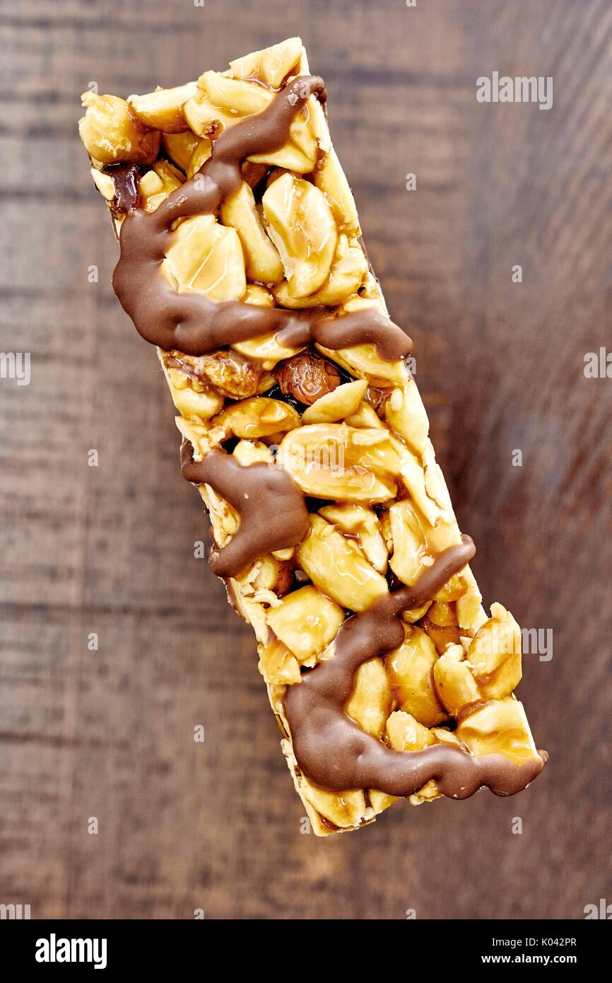 A studio photo of a choc coated nut bar Stock Photo - Alamy