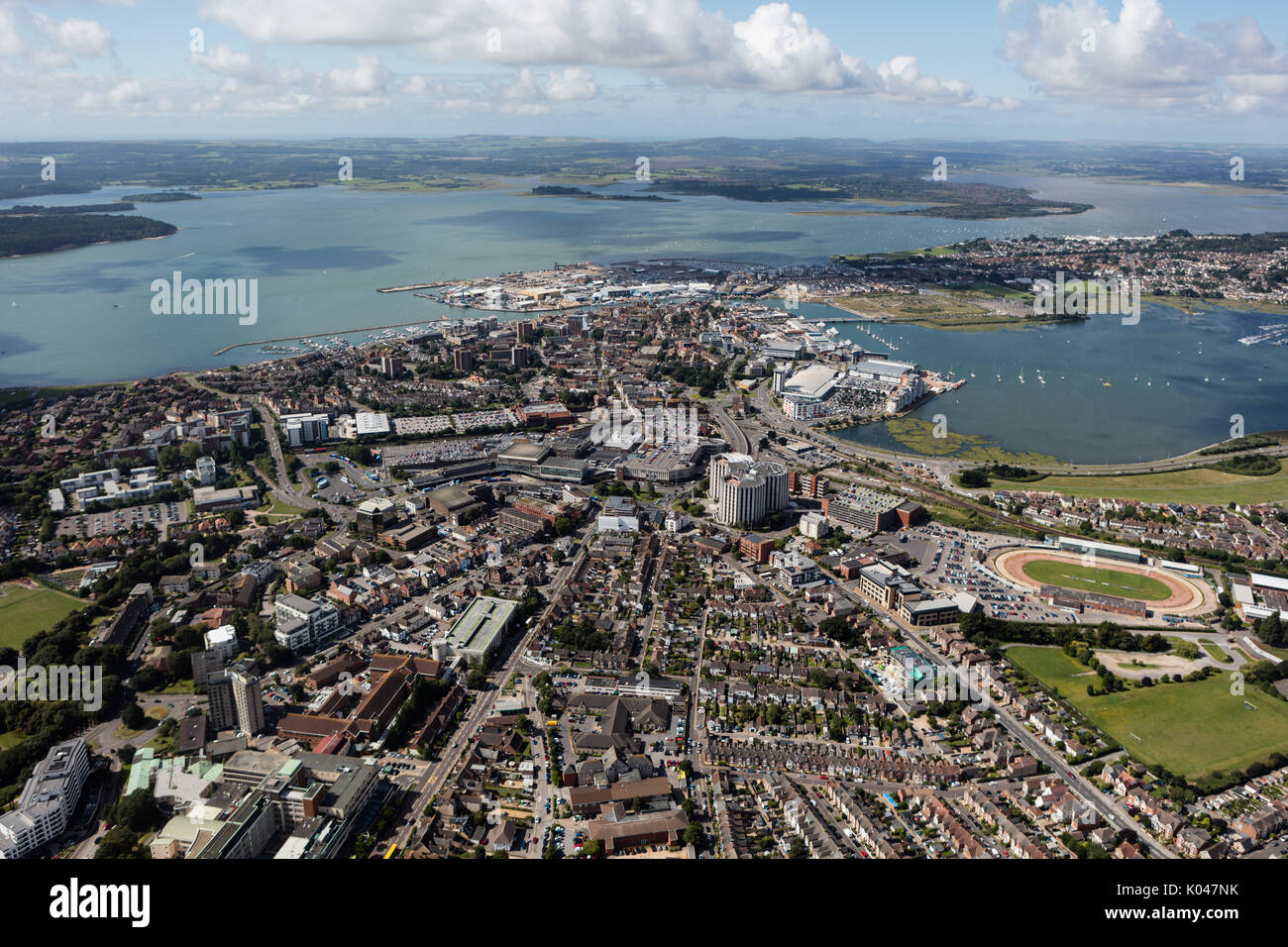 A wide aerial view of the Dorset town of Poole and surrounding harbour ...