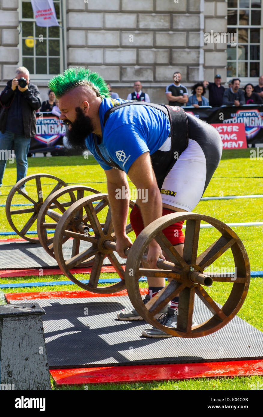 Competitors strain in the power lifting heat of the Ultimate Strongest ...