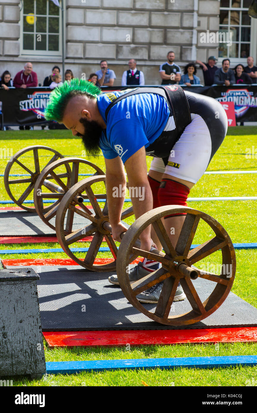 Competitors strain in the power lifting heat of the Ultimate Strongest ...