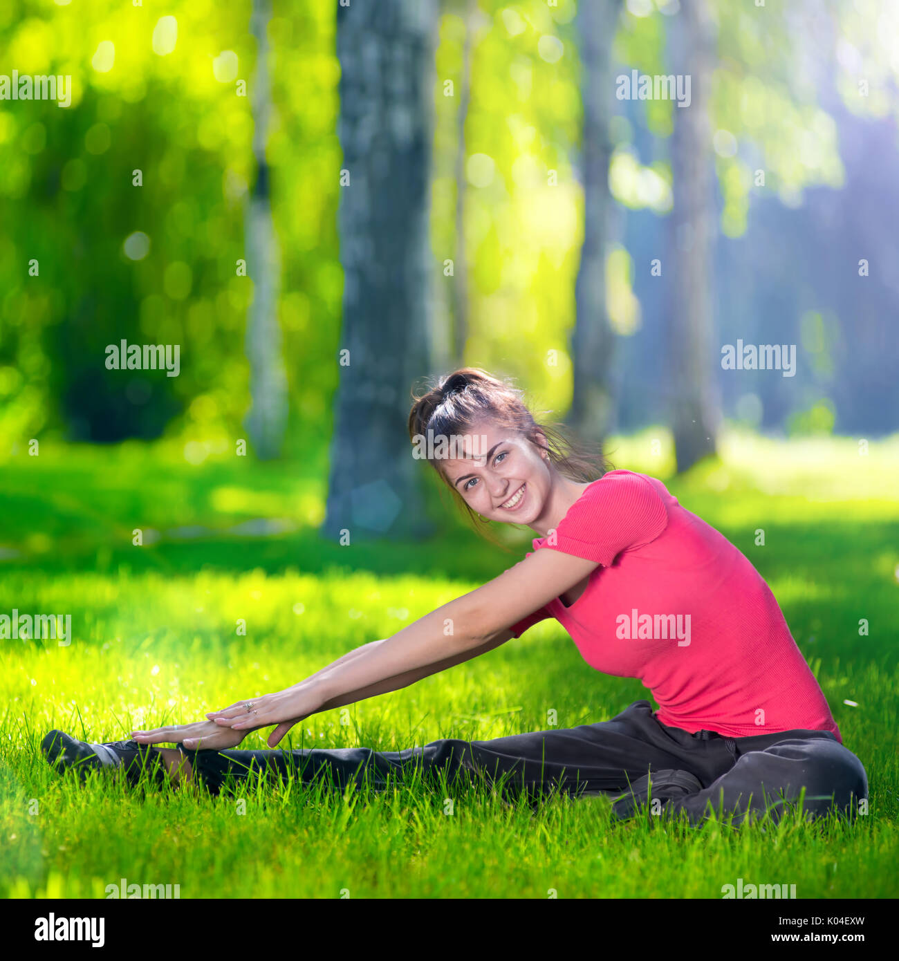 Stretching woman in outdoor sport exercise Stock Photo - Alamy