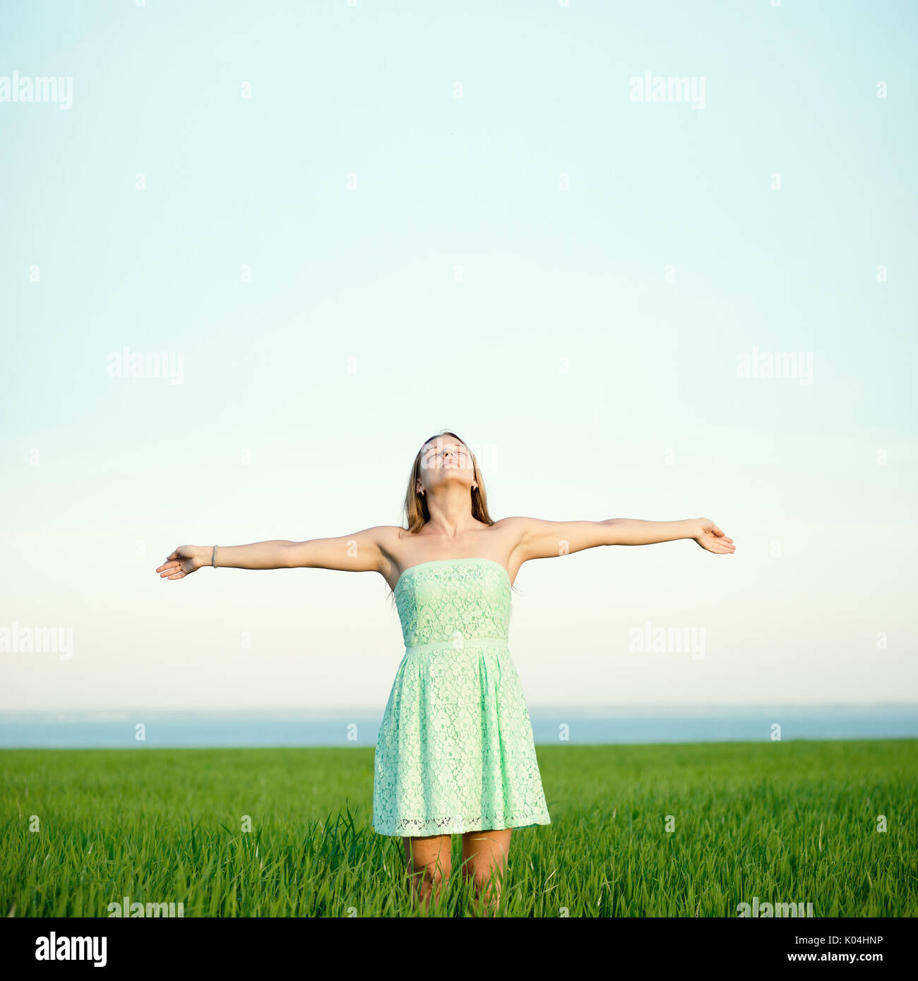 Happiness woman stay outdoor under sunlight of sunset Stock Photo - Alamy