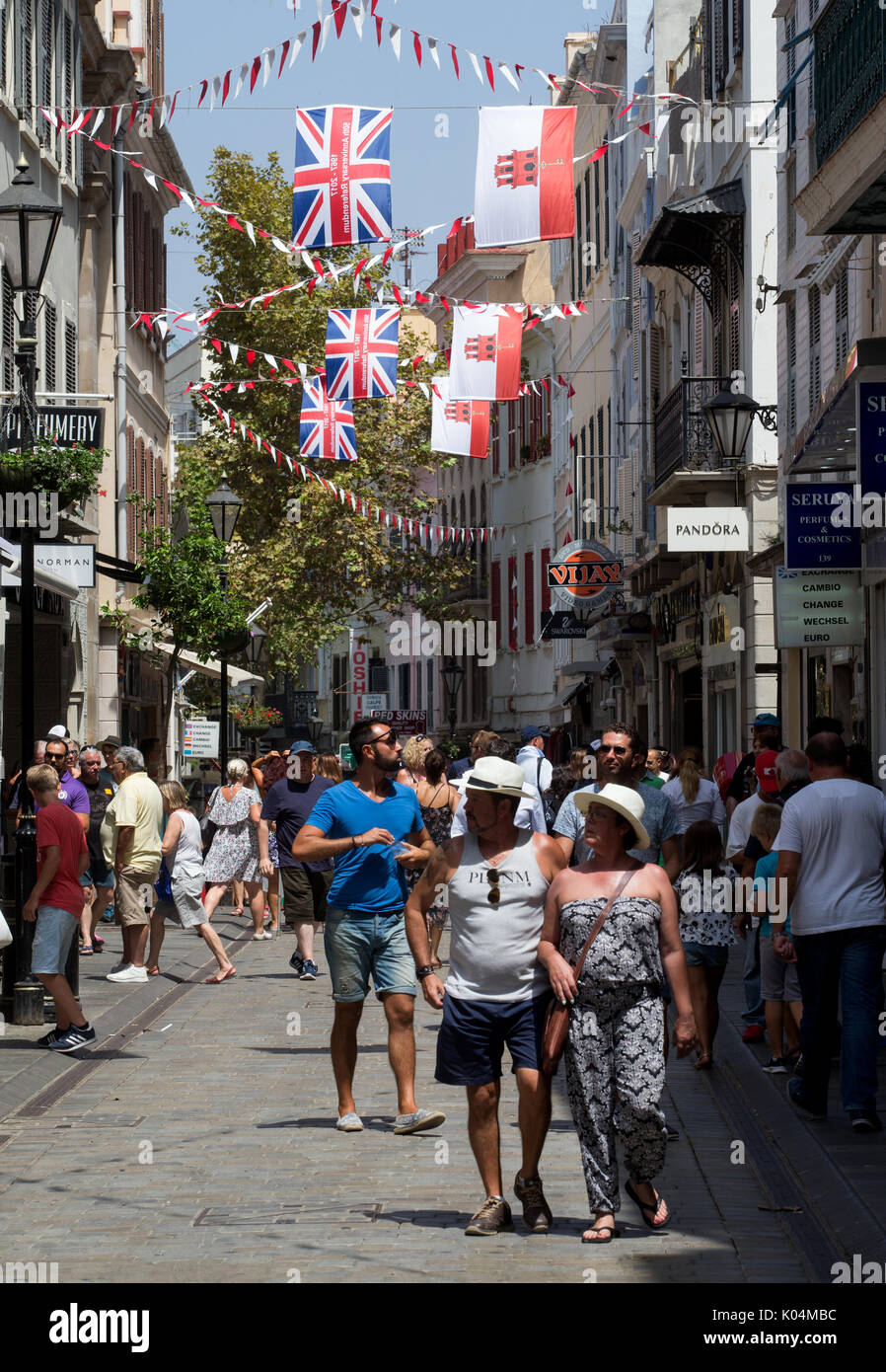 People strolling along Main Street in the UK dependency of Gibraltar ...