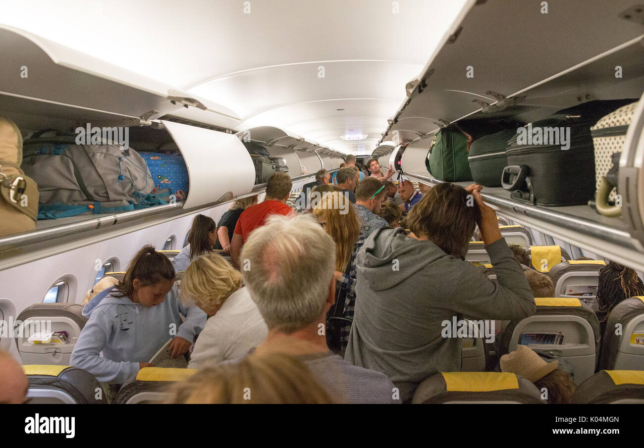 Airplane luggage rack hi-res stock photography and images - Alamy