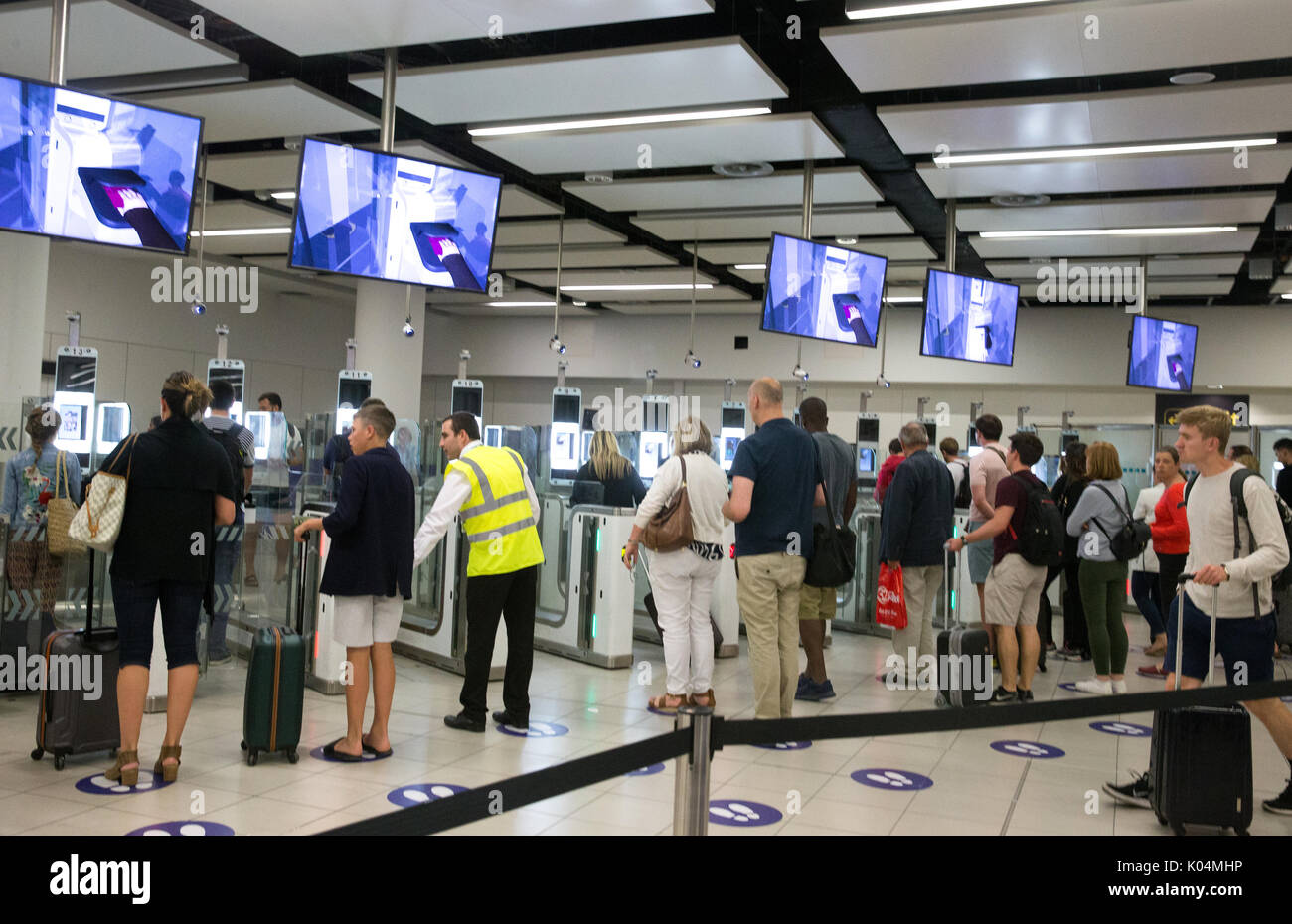 People at the UK border at Gatwick airport waiting to go through the ...