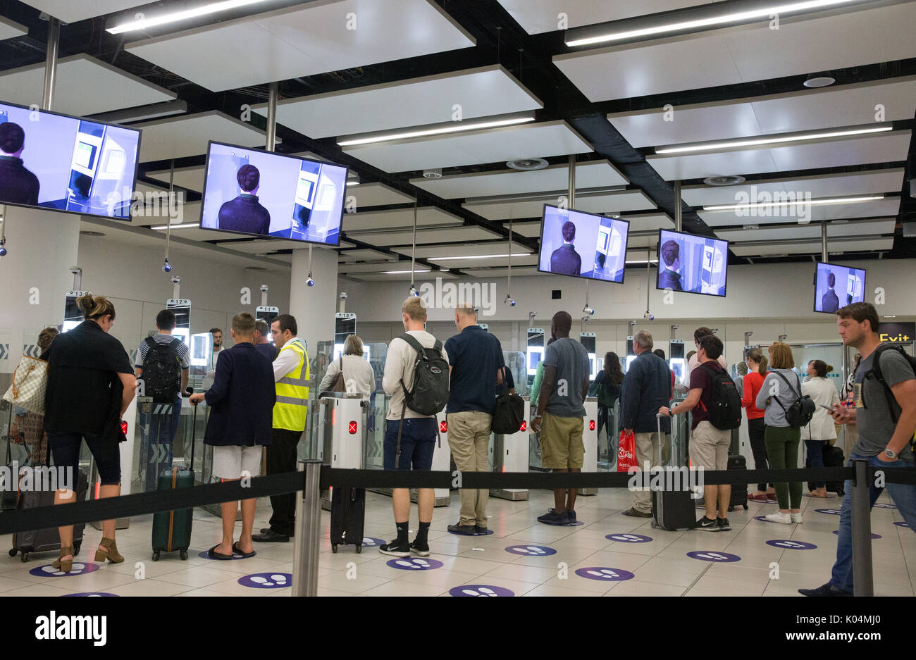 People at the UK border at Gatwick airport waiting to go through the ...