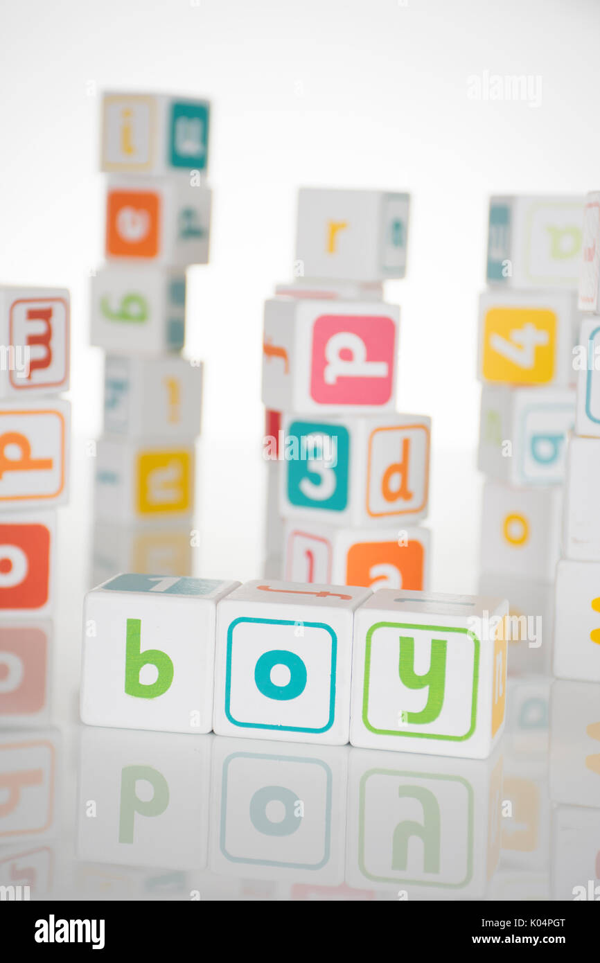 Boy spelled out in toy building blocks Stock Photo - Alamy