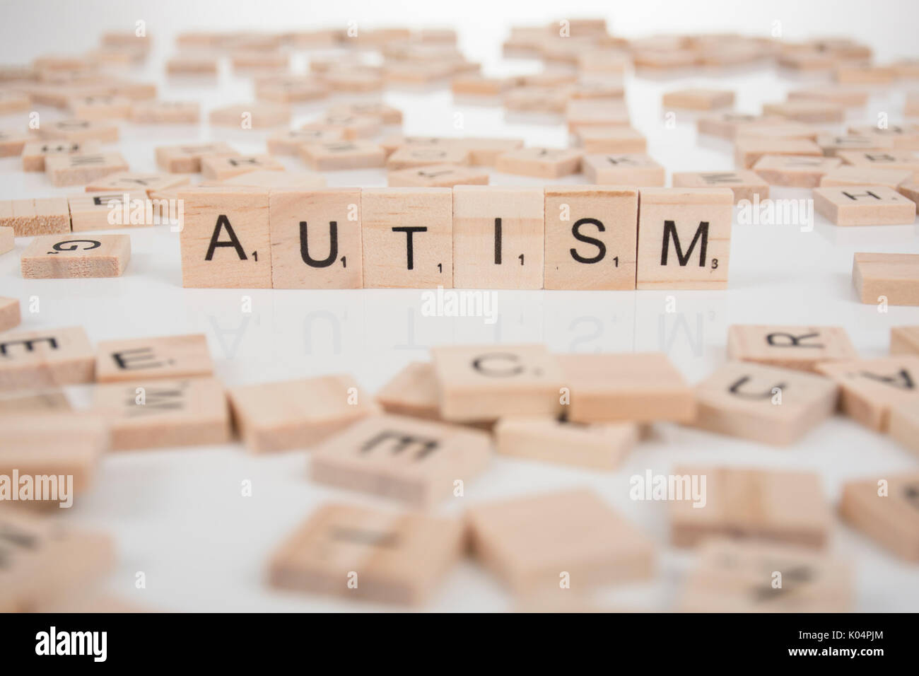Autism spelled out in scrabble letters Stock Photo - Alamy