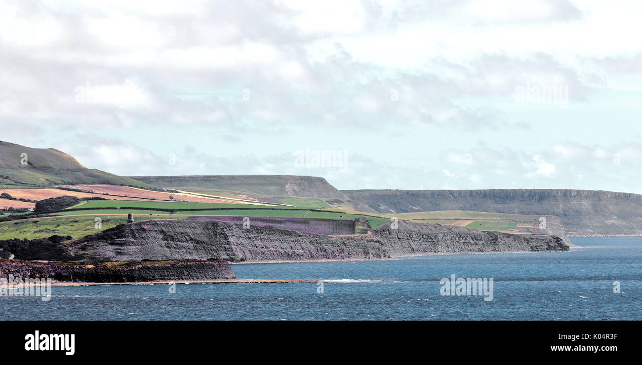 Kimmeridge, Clavell Tower, oil bearing shale in cliff faces and distant ...