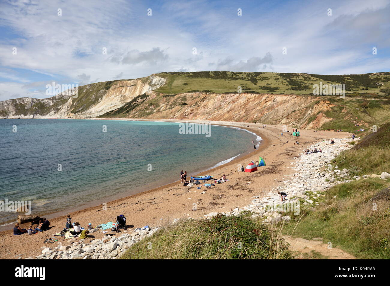 Visitors enjoying warm summer’s day at Worbarrow Bay, near Tyneham ...