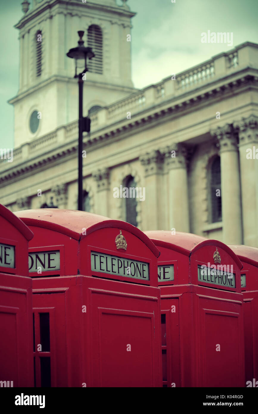 Red telephone box in street with historical architecture in London ...