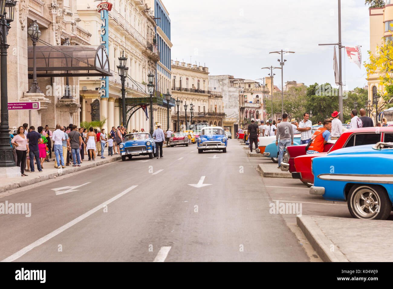 Classic American cars driving on Paseo de Marti at Hotel Inglaterra, in ...