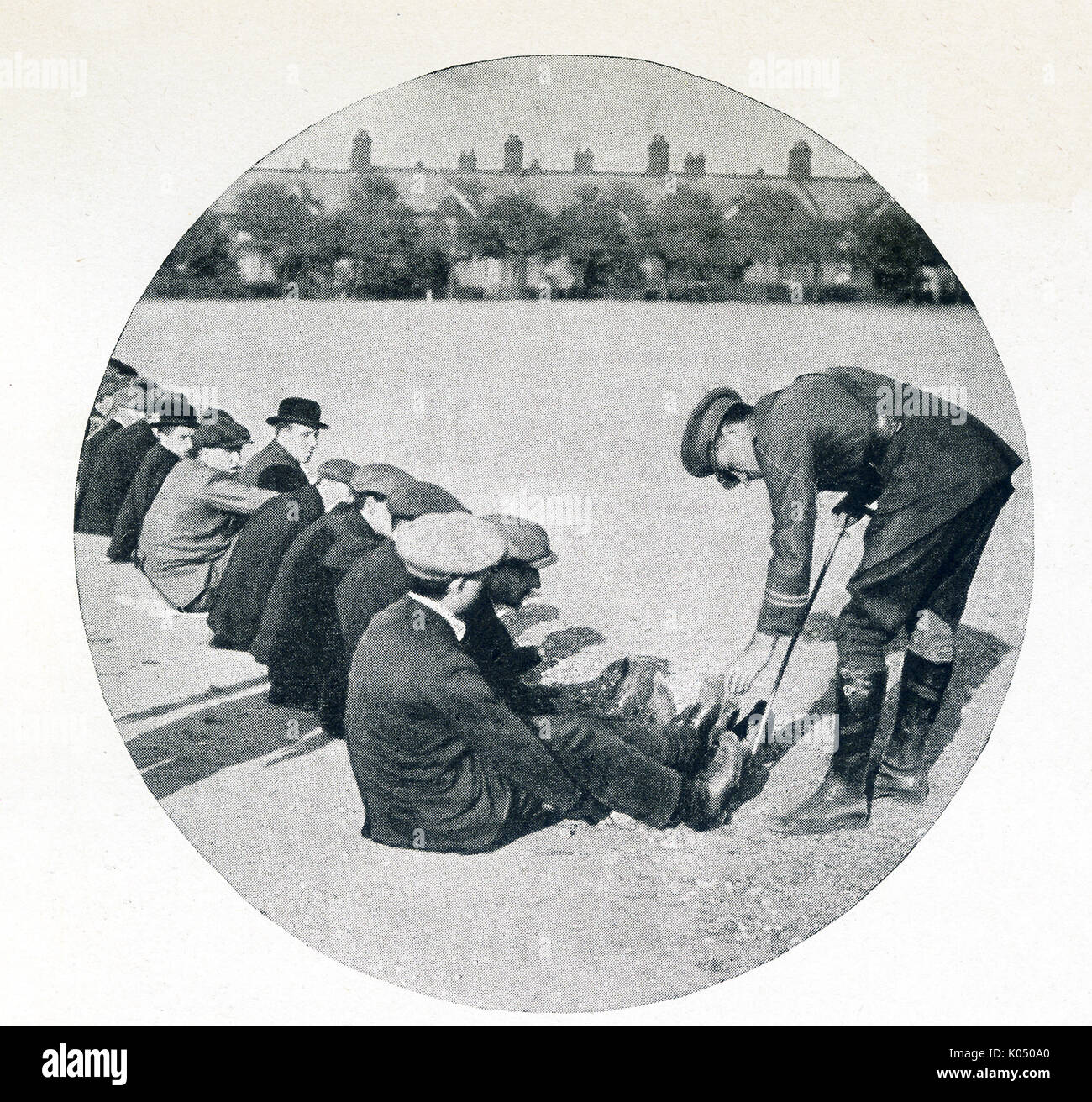 This photo taken in early World War I has the caption: Boot inspection ...