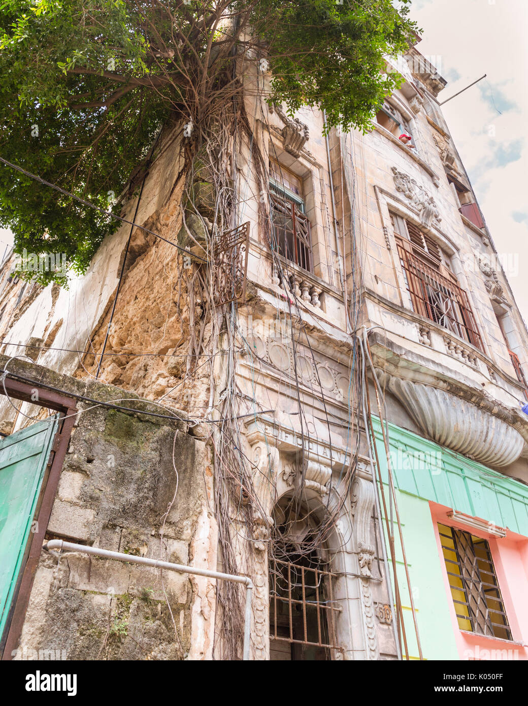 Electrical cables and telecommunications wires tangled and hanging down ...