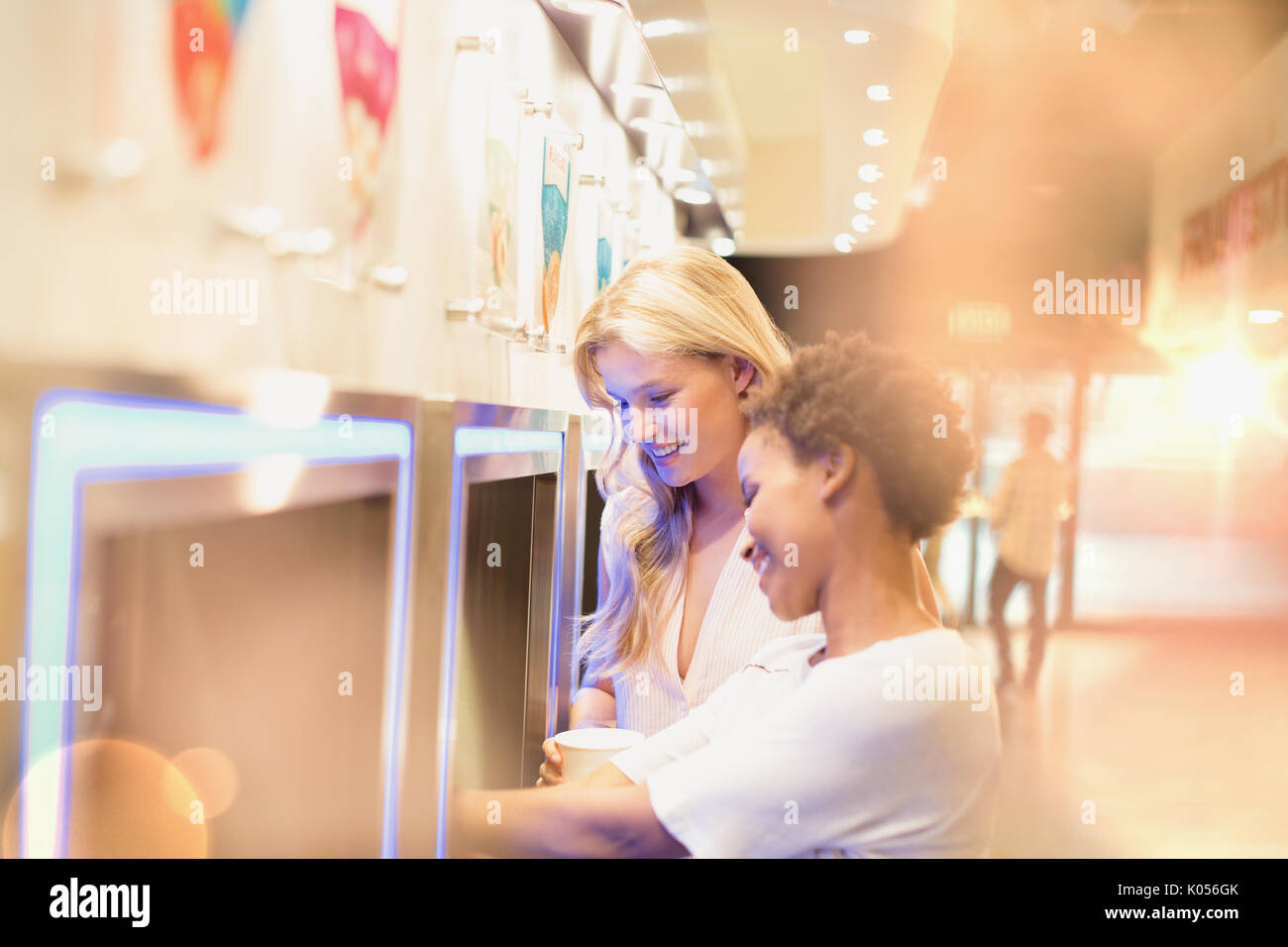 Young women friends at self-serve frozen yogurt in market Stock Photo ...