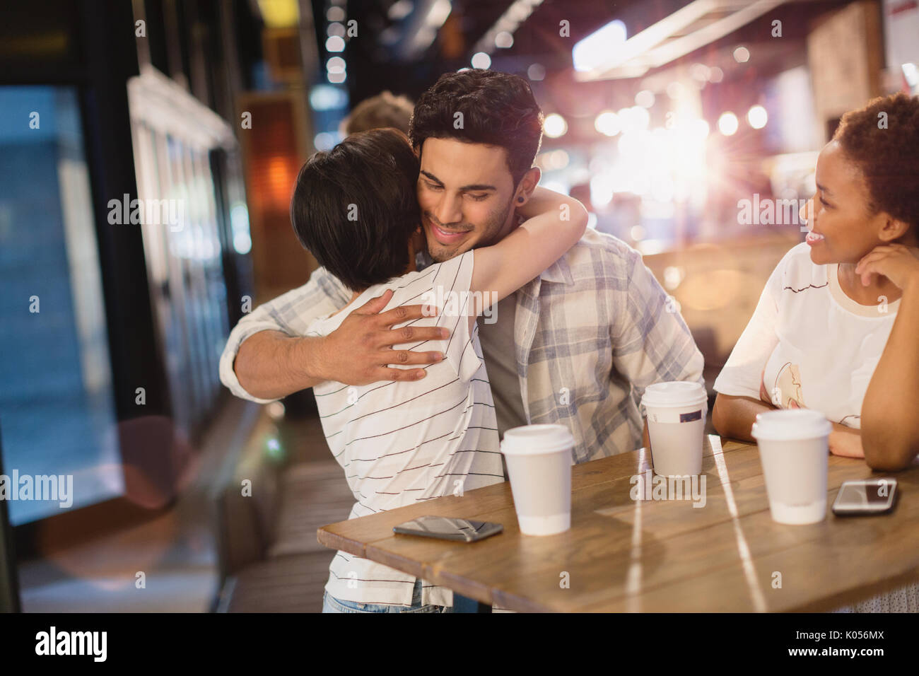 People Hugging Goodbye
