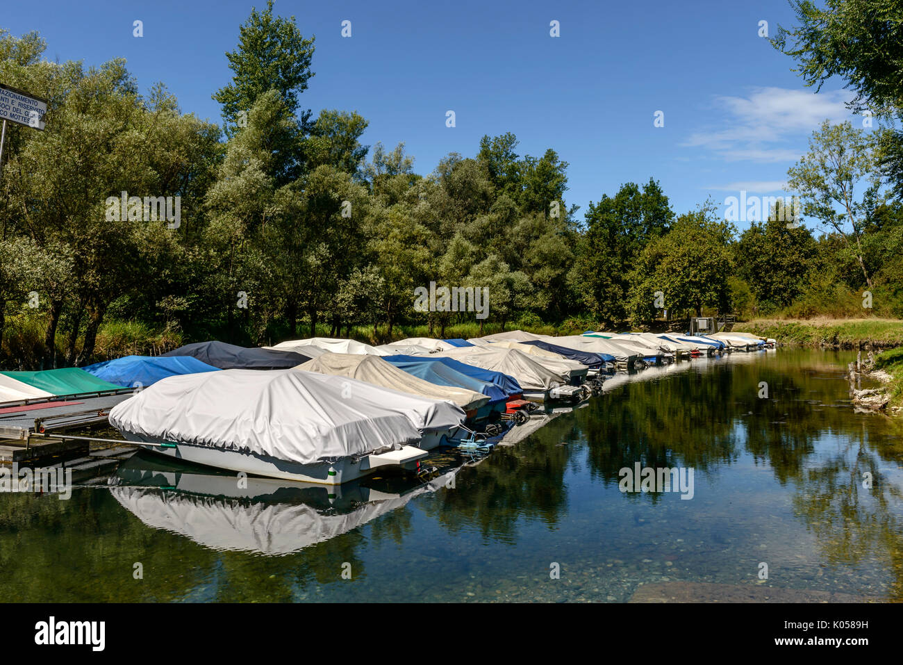 floating quay at river harbor, shot in a bright summer day in Ticino ...